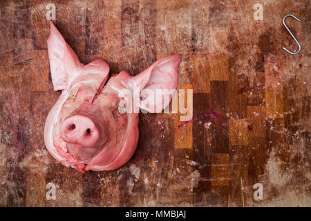 Pigs Head on Butchers Block Stock Photo - Alamy