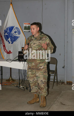 Lt. Col. Jeffrey Ignatowski, center, receives the Letterkenny Munitions ...