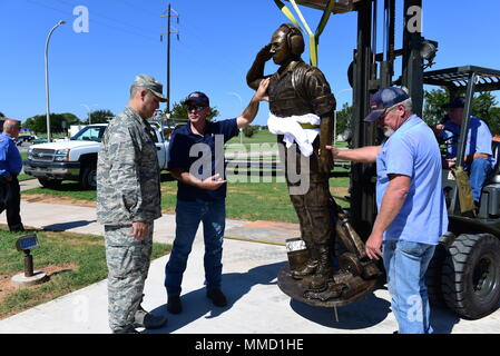 Sheppard installs maintenance man statue Stock Photo - Alamy