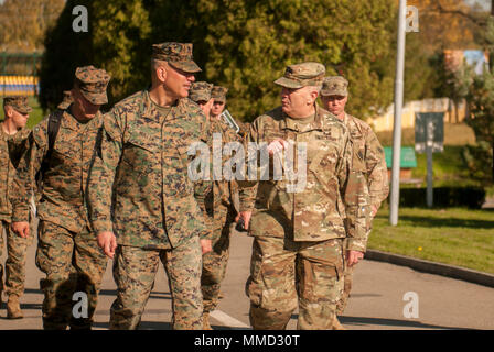 U.S. Marine Corps Col. Jordan Walzer poses with his family following ...