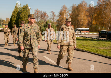 U.S. Marine Corps Col. Jordan Walzer poses with his family following ...