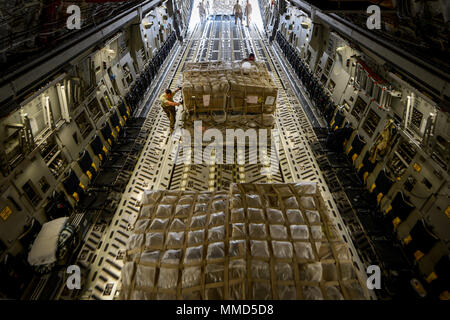 C-17 Loadmaster Staff Sgt. Benjamin Cato from the 21st Airlift Squadron ...