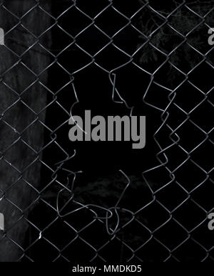 Ripped wire fence with black background Stock Photo - Alamy