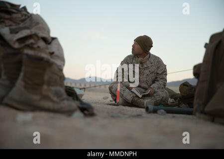 Navy Lieutenant Junior Grade Chaplain Kyle Lambertson, right, anoints ...