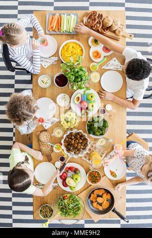 Top view children birthday table concept. Chocolate muffin sparkler and ...