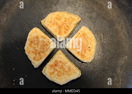 Scottish bannock or scone made as a flat quick bread prepared round ...