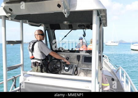 The owner of a displaced vessel on St. John talks with a special agent ...