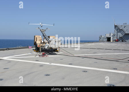 A ScanEagle unmanned aerial vehicle launches from its catapult Stock ...