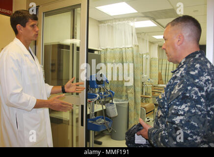 Capt. Jeffrey Bitterman, center left, U.S. Pacific Fleet Surgeon and co ...