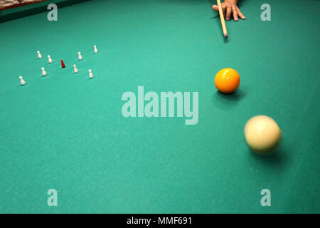 Italian billiards - bowling pins and balls Stock Photo - Alamy