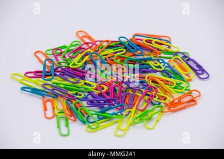Colourful neon paper clips / fasteners isolated on a white background ...