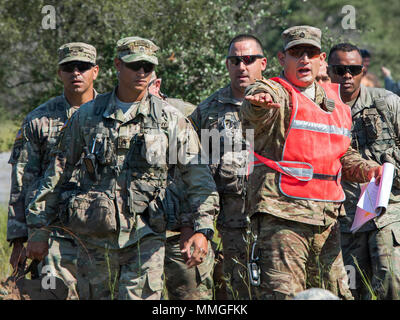 U.S. Army 6th Ranger Training Battalion members assess and stabilize a ...