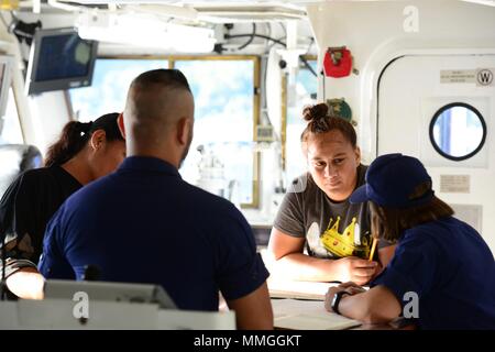 Petty Officer 1st Class Ruby Oyola, a storekeeper aboard U.S. Coast ...