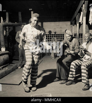African American convicts in a Southern work gang breaking up rocks ...