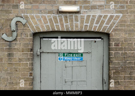 Detailed image of a fire exit door and sign seen attached to an old ...
