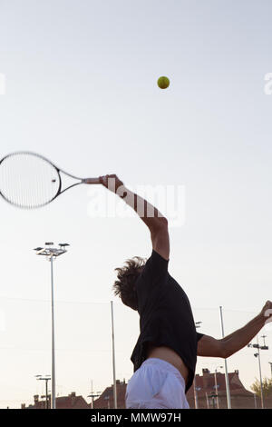 Tennis racket and ball on dark background, closeup Stock Photo - Alamy