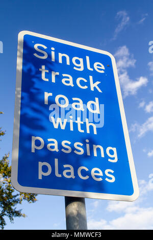 Blue single track road signl Stock Photo - Alamy