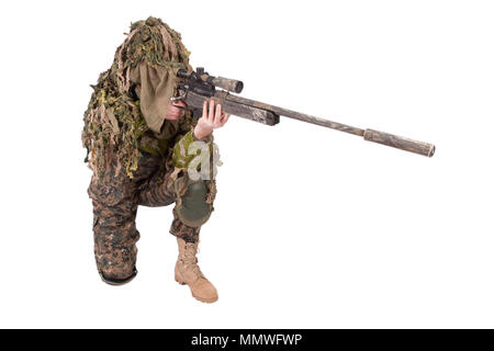 Camouflaged sniper in the forest in ambush. Military man aiming a gun, a rifle at the enemy in ...