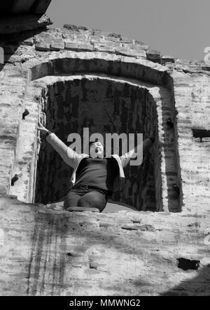 Man stands in an abandoned building. wandering men. man in a protective ...