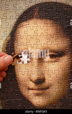Mona Lisa painting as a jigsaw puzzle unfinished Stock Photo - Alamy
