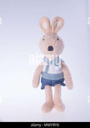 Rabbit toy, isolated on solid green background Stock Photo - Alamy