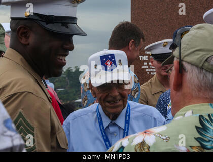 U.S. Marine Corps veteran Harold Berg, who fought in World War II, lays ...