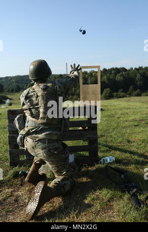 A U.S. Army Soldier practices the throwing M69 practice hand grenades ...