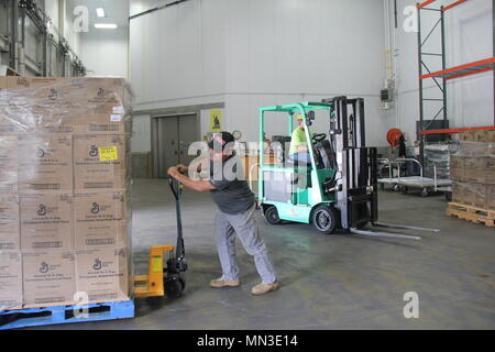 Todd Effinger and Tamra Meyer, supply technicians with the Subsistence Supply Management Office ...