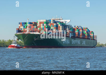 Tug boat ZP BOXER maneuvering container vessel CSCL MARS to its berth ...