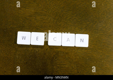 CAN word written on plastic keyboard alphabet with dark background ...