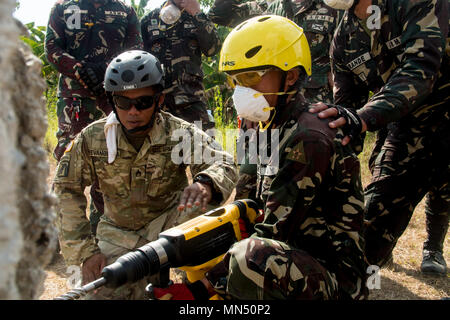 Soldiers of the Philippines Army 525th Engineer Combat Battalion take ...