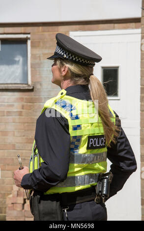 Portrait of a uniformed police officer holding handcuffs Stock Photo ...