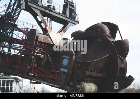 The huge coal mining machine captured with mining wheel from the front ...