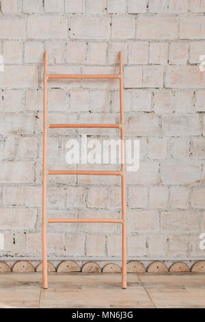 Ladder for clothes in a loft style of wood Stock Photo - Alamy