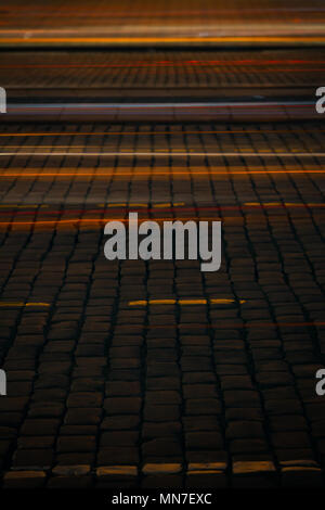 Light trails over stone pavement Stock Photo - Alamy