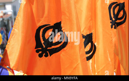 Orange flag with a Khanda symbol, religious emblem for the Sikhs and ...