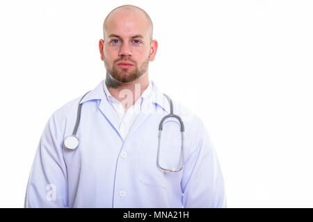 Young bald muscular man doctor thinking while looking up Stock Photo ...