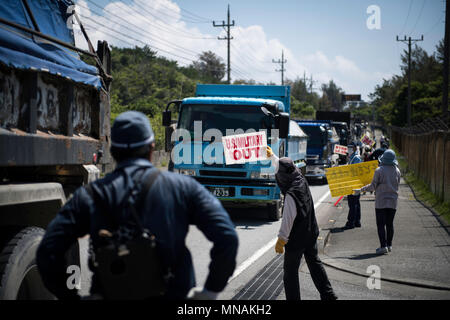 NAGO, JAPAN - MAY 16 : Protesters with placards block construction ...