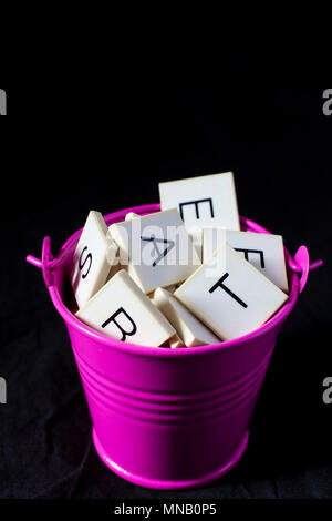letter blocks in a bucket Stock Photo - Alamy