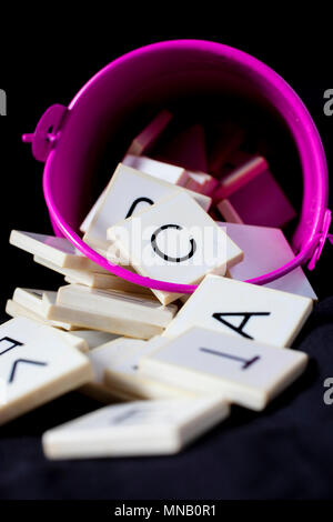 letter blocks in a bucket Stock Photo - Alamy