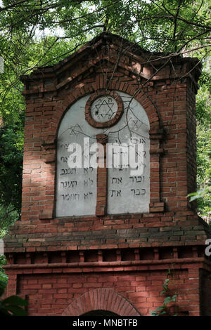 The ten commandments in Hebrew inscribed over a wooden Torah Ark closet ...