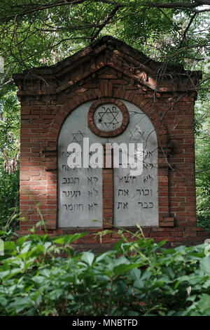 The ten commandments in Hebrew inscribed over a wooden Torah Ark closet ...