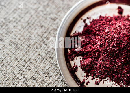 Dried Sumac, sumah or sumak on silver plate (arabic cuisine) Organic ...