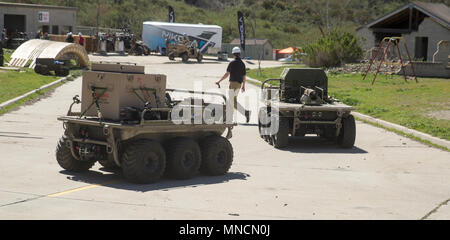 A Multi-Utility Tactical Transport (MUTT) demonstrates its capabilities ...