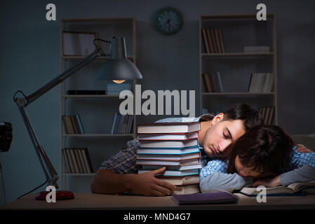 Two students studying late at night Stock Photo - Alamy
