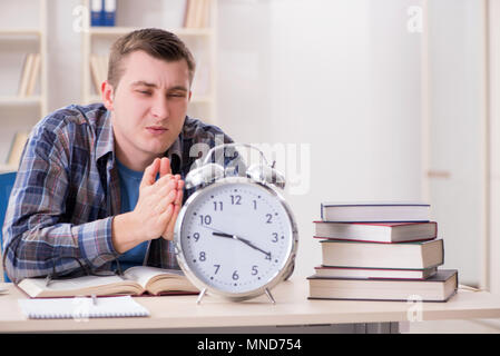 Student getting late with exam preparation Stock Photo - Alamy