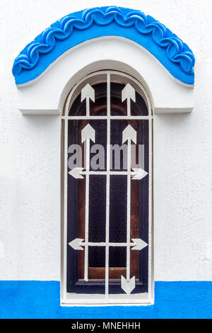 Blue window with styled iron grid Stock Photo - Alamy
