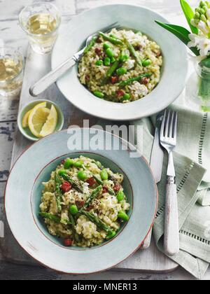 Spring risotto with green asparagus and peas Stock Photo - Alamy