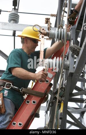 Electric power lineman installing new lines in Boise Idaho Stock Photo ...
