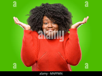 Beautiful african woman doubt expression, confuse and wonder concept ...